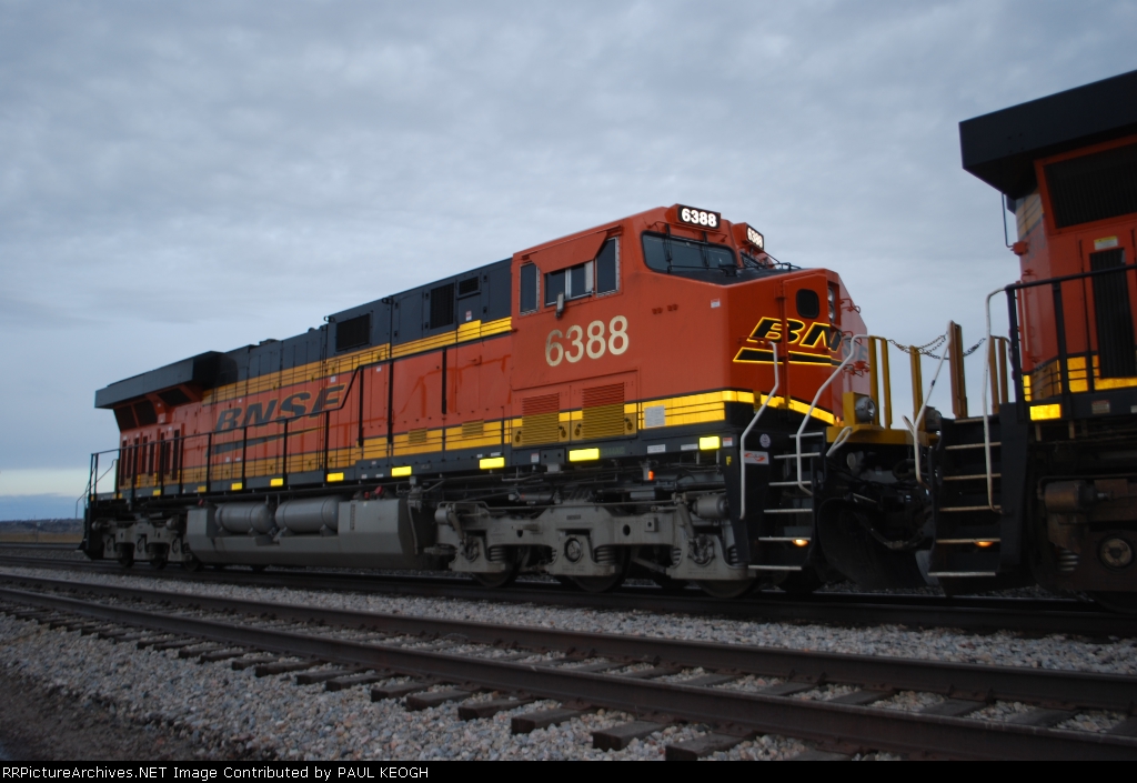 BNSF 6388 sits on the siding waiting to roll eastbound towards Edgemont, SD as a rear DPU on a ...